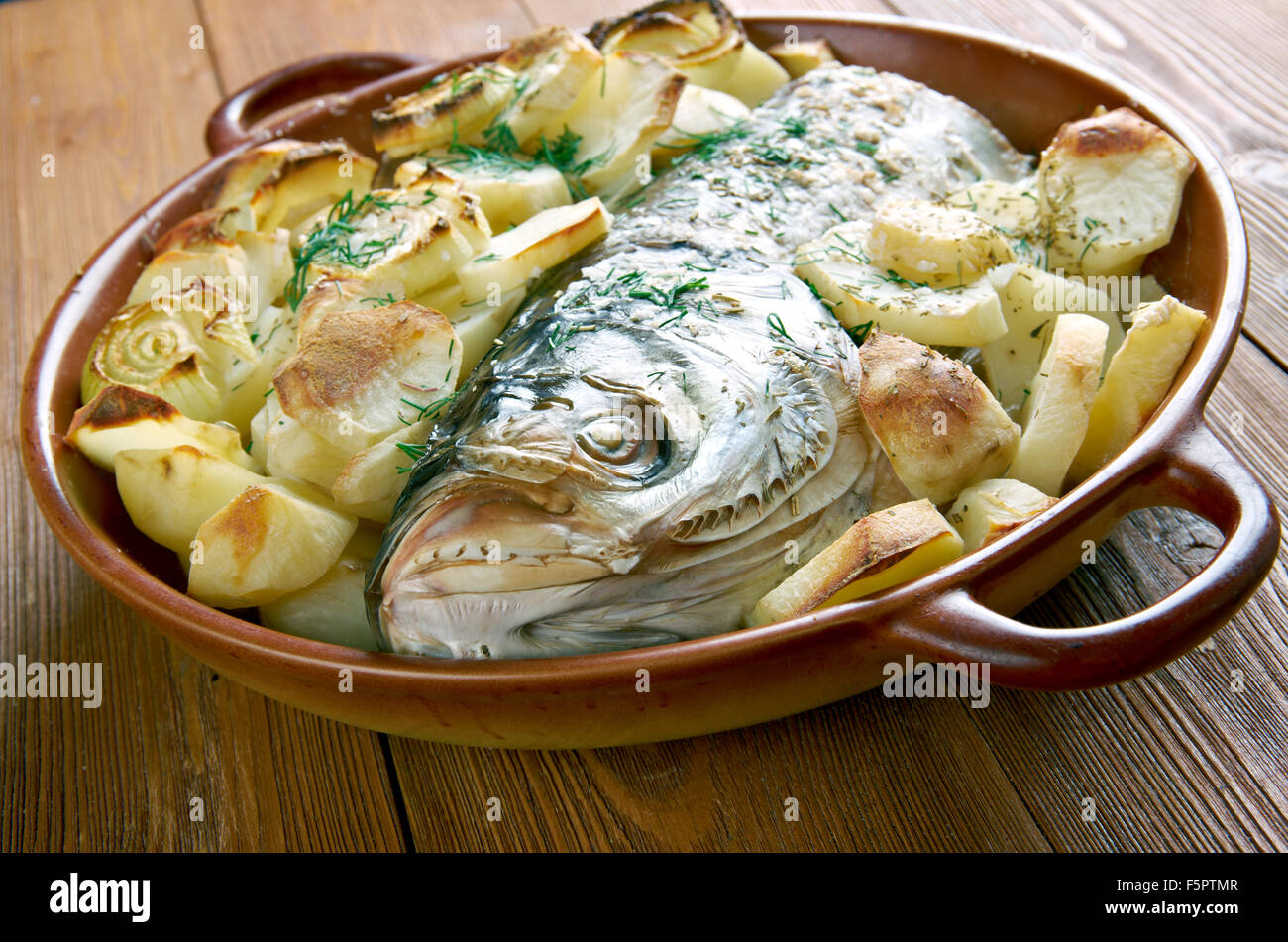 Psari sto fourno.baked fish. Cypriot cuisine Stock Photo - Alamy