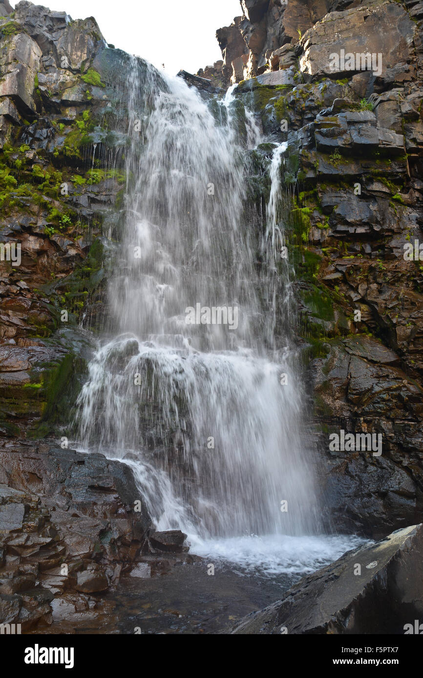 Waterfall on the Putorana plateau. Summer mountain landscape, decorated ...
