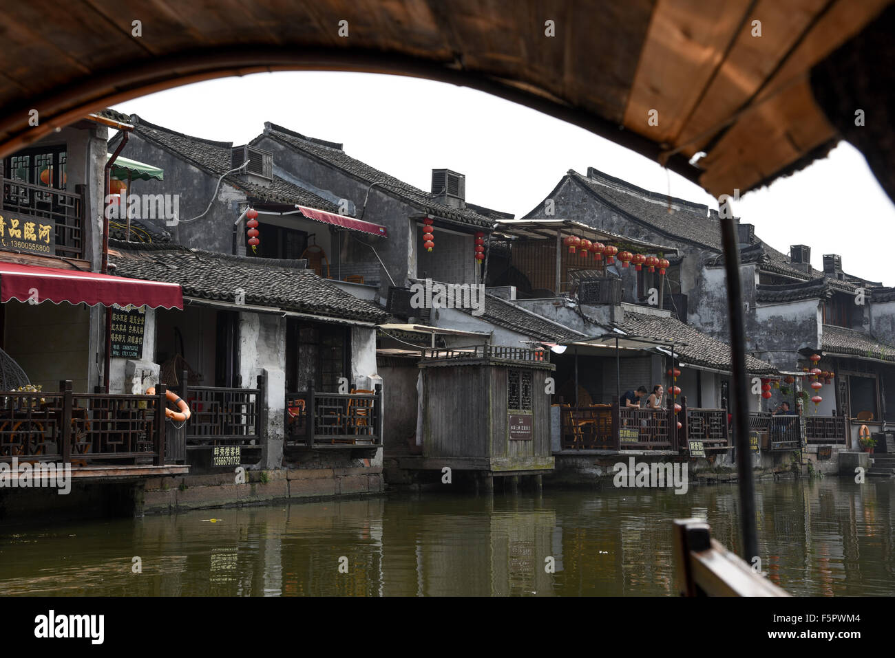 old traditional buildings on riverside Hangzhou China look out from a ...