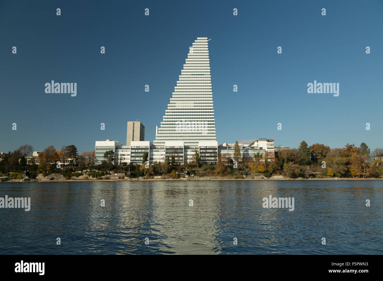A photograph of the new Roche Tower (Building 1, or Bau 1) on the banks ...