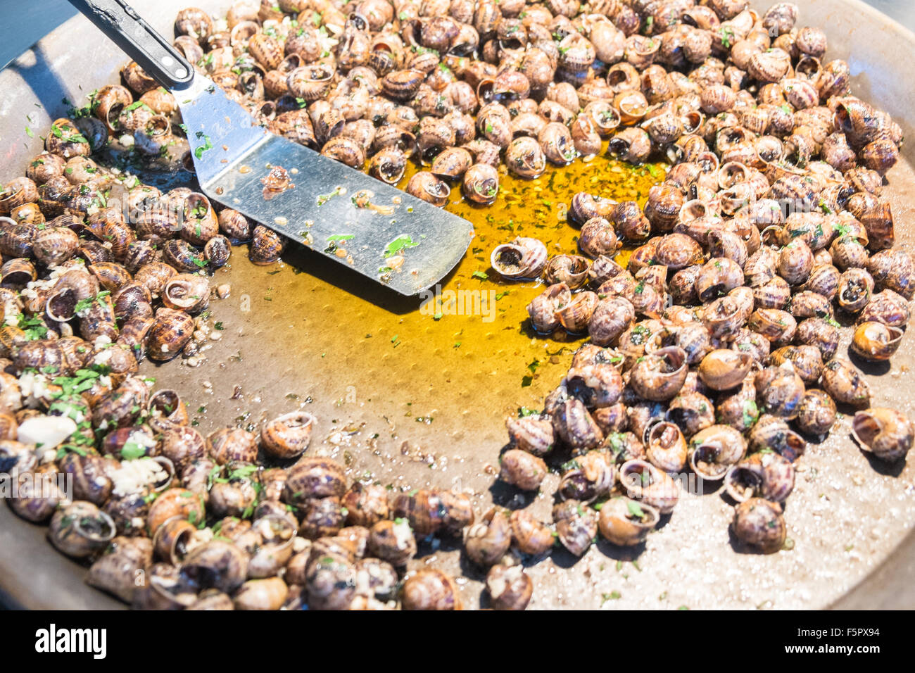 Snails, being, cooked,escargot,French delicacy at stall at Esperaza ...