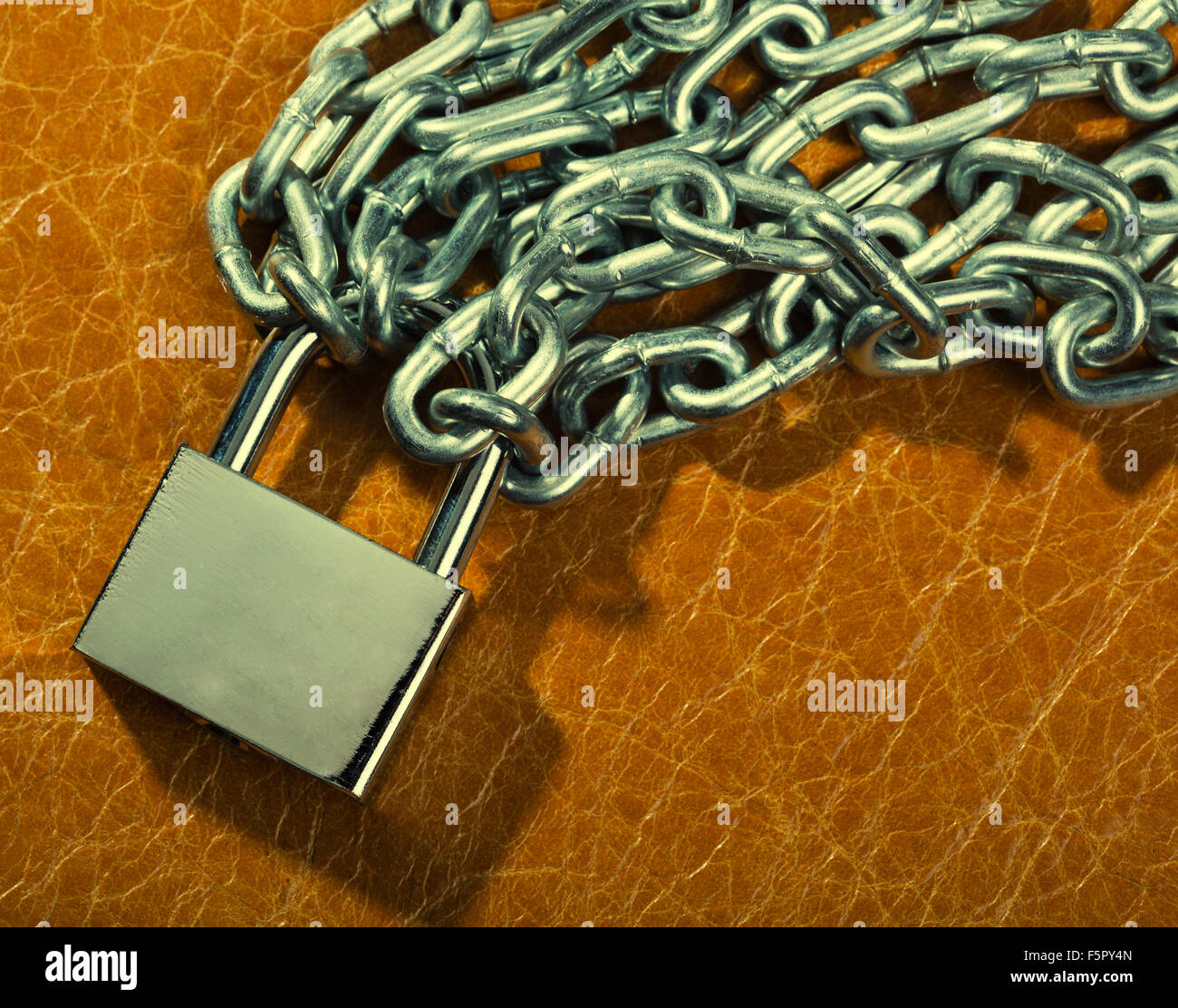 Macro view of padlock and chains Stock Photo - Alamy