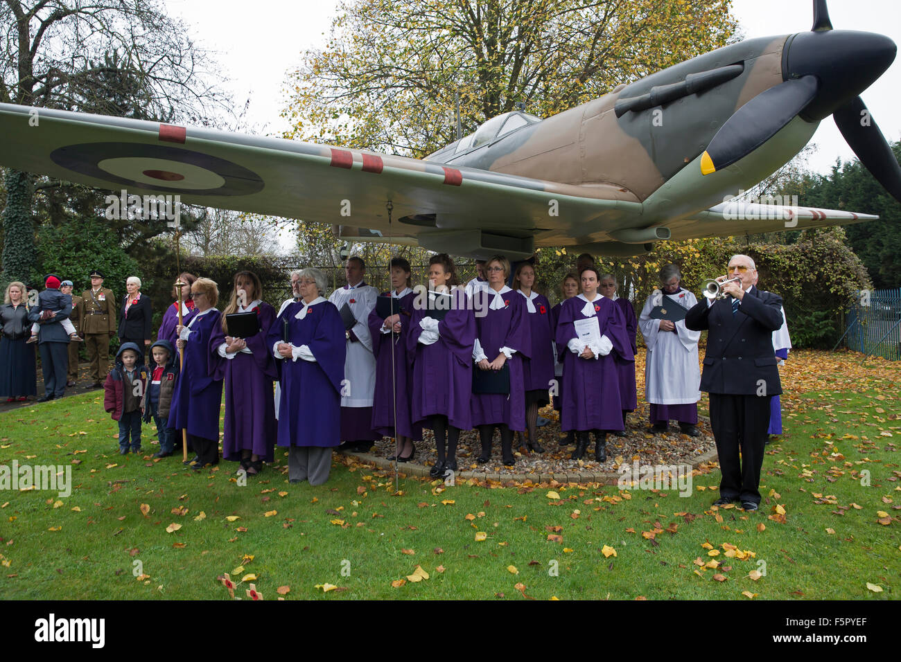 Biggin Hill,UK,8th November 2015,Choir stand under a spitfire at St ...