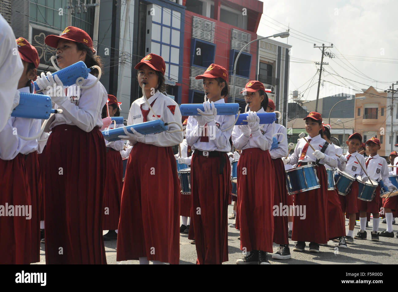 Makassar, Indonesia. 08th Nov, 2015. Elementary students play melodicas ...