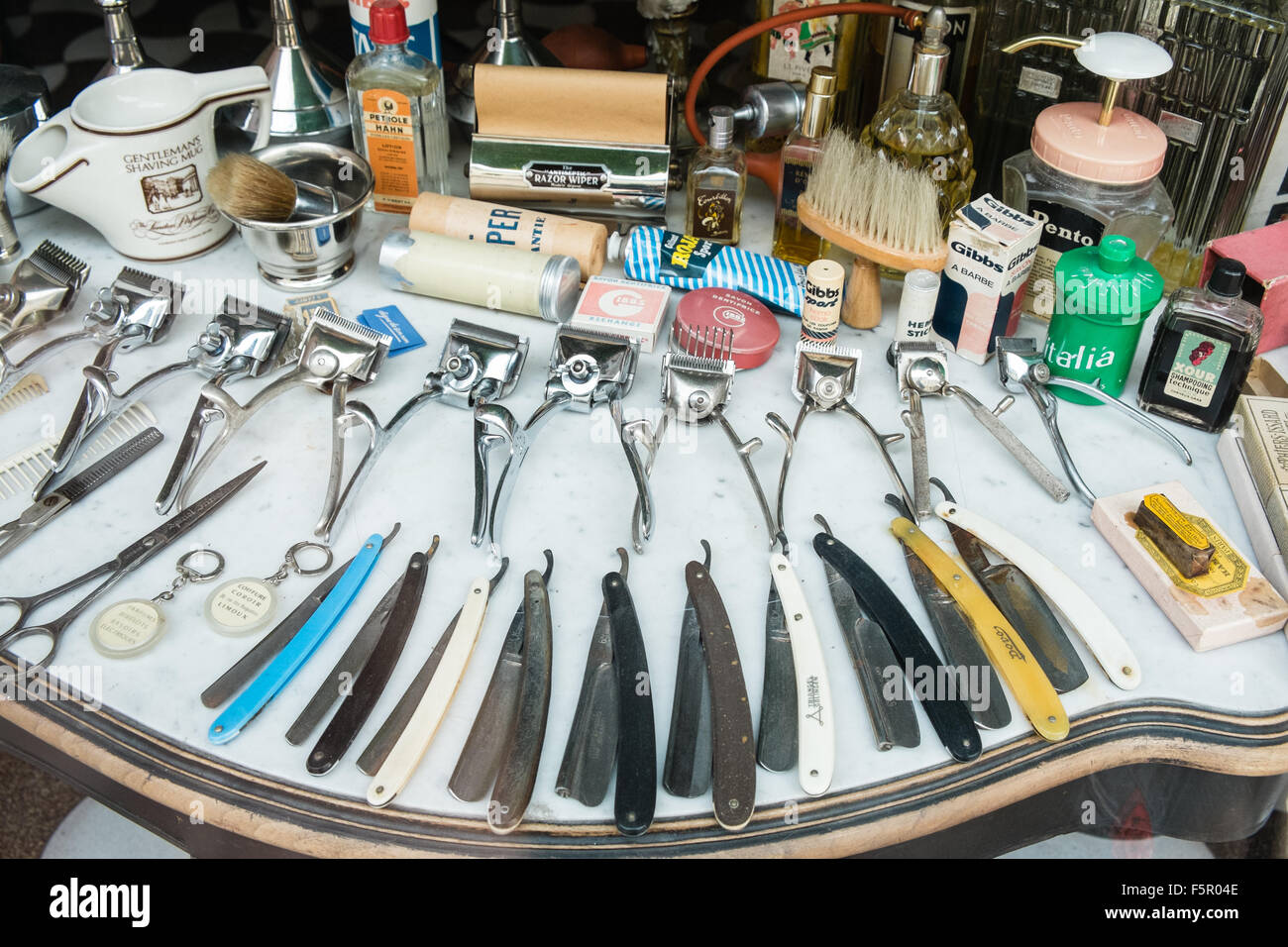 Cut throat razor blades and old clippers on display at gents barbers ...