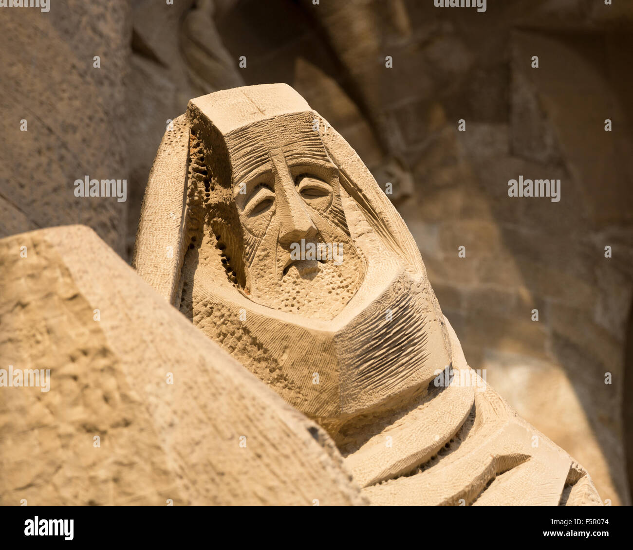 Sandstone figure of sad saint Stock Photo - Alamy