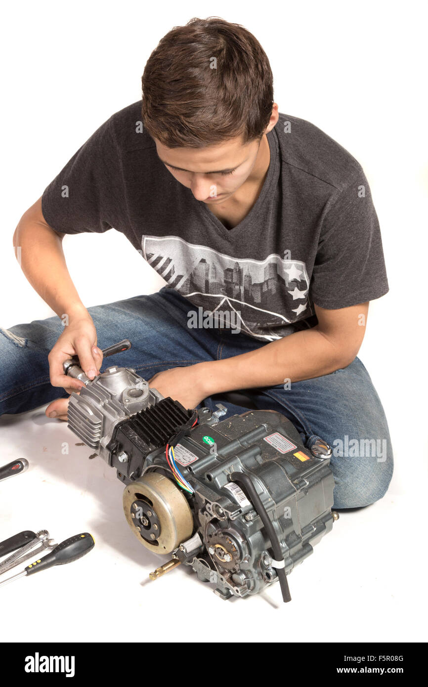Teenage Boy Fixing an Engine Stock Photo - Alamy