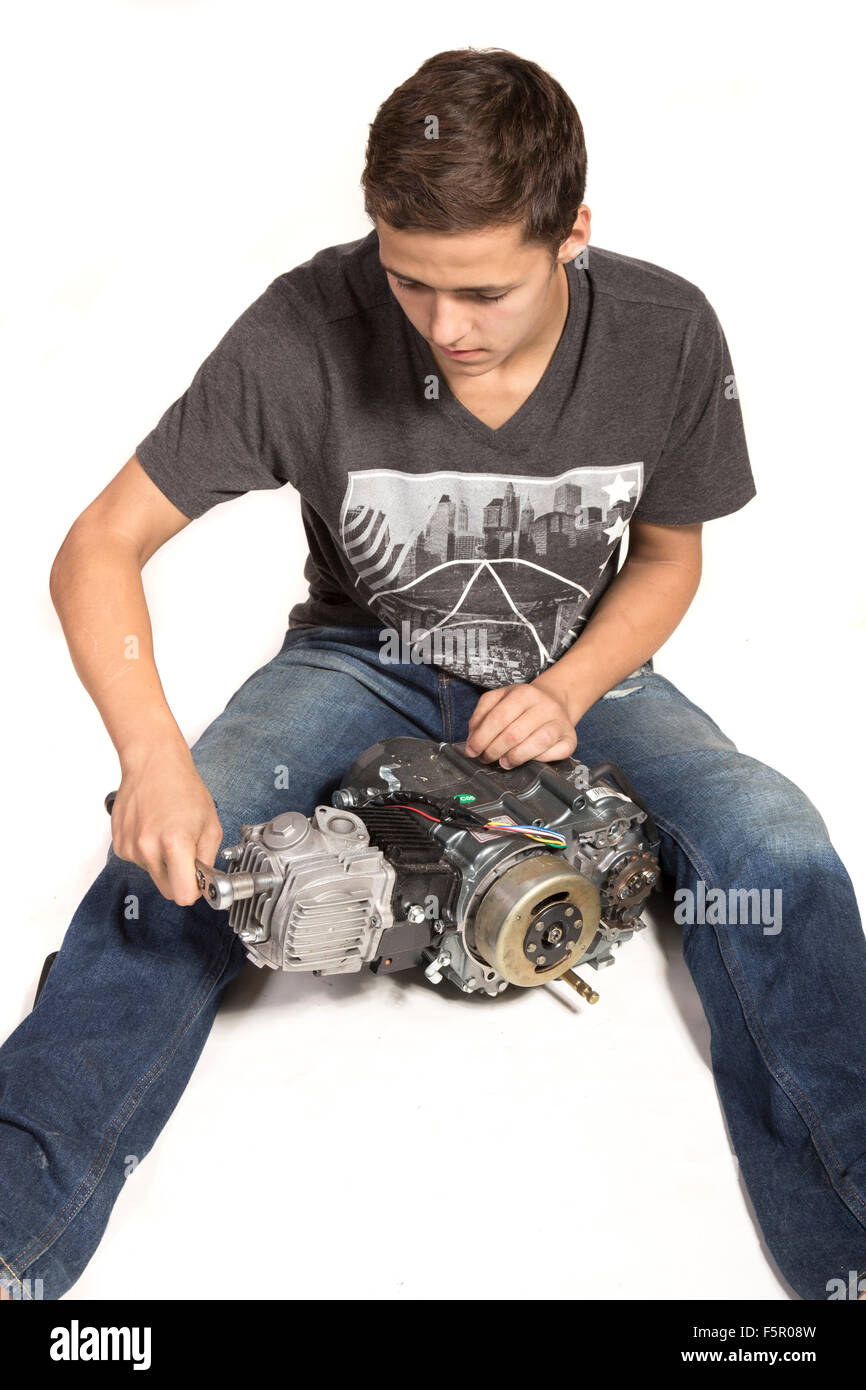 Teenage Boy Fixing an Engine Stock Photo - Alamy