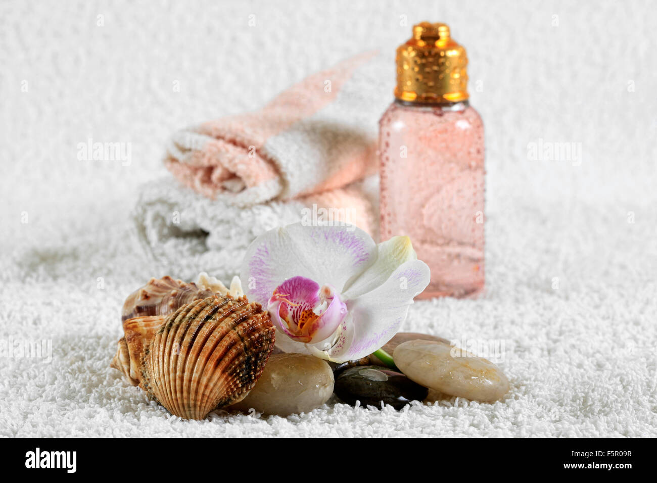 Bodycare products and a beautiful orchid Stock Photo - Alamy