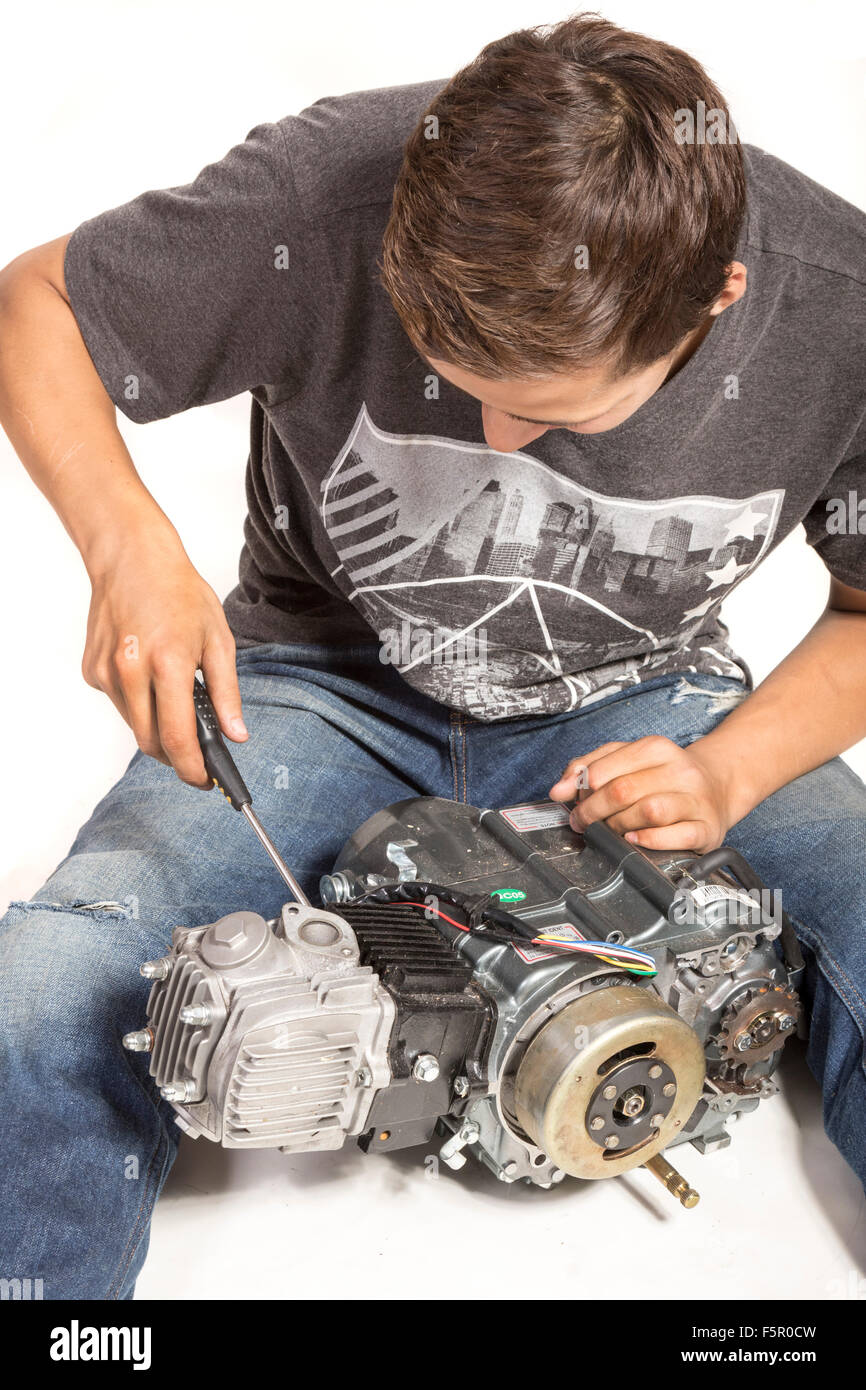 Teenage Boy Fixing an Engine Stock Photo - Alamy