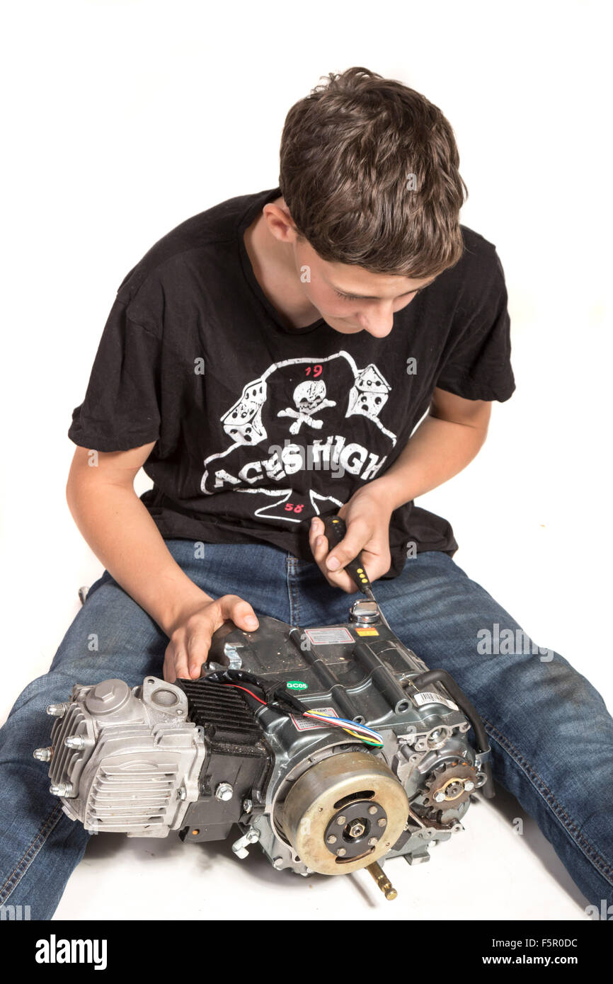 Teenage Boy Fixing an Engine Stock Photo - Alamy