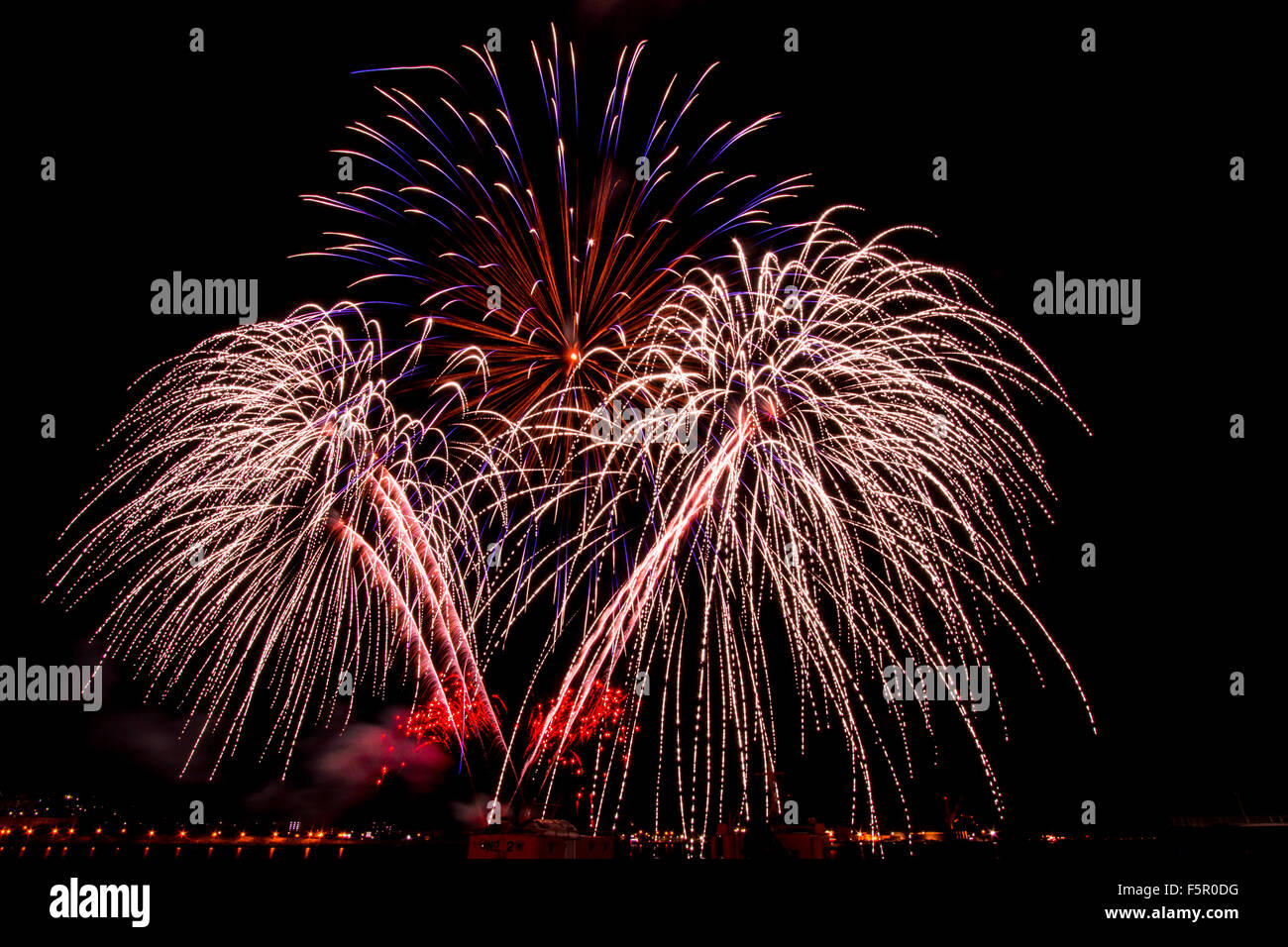 Fireworks over the city celebrate in happy festival Stock Photo - Alamy