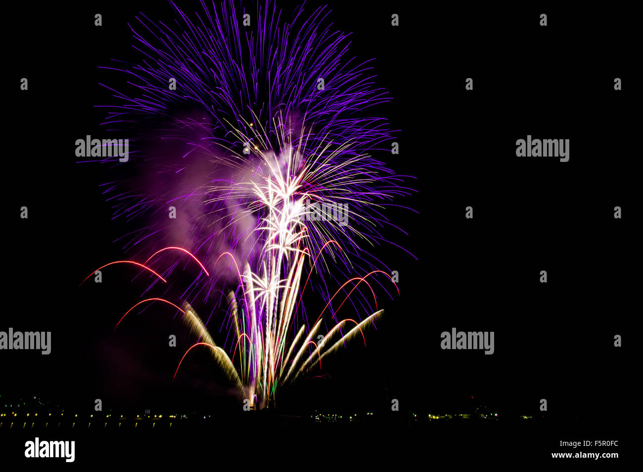 Fireworks over the city celebrate in happy festival Stock Photo - Alamy