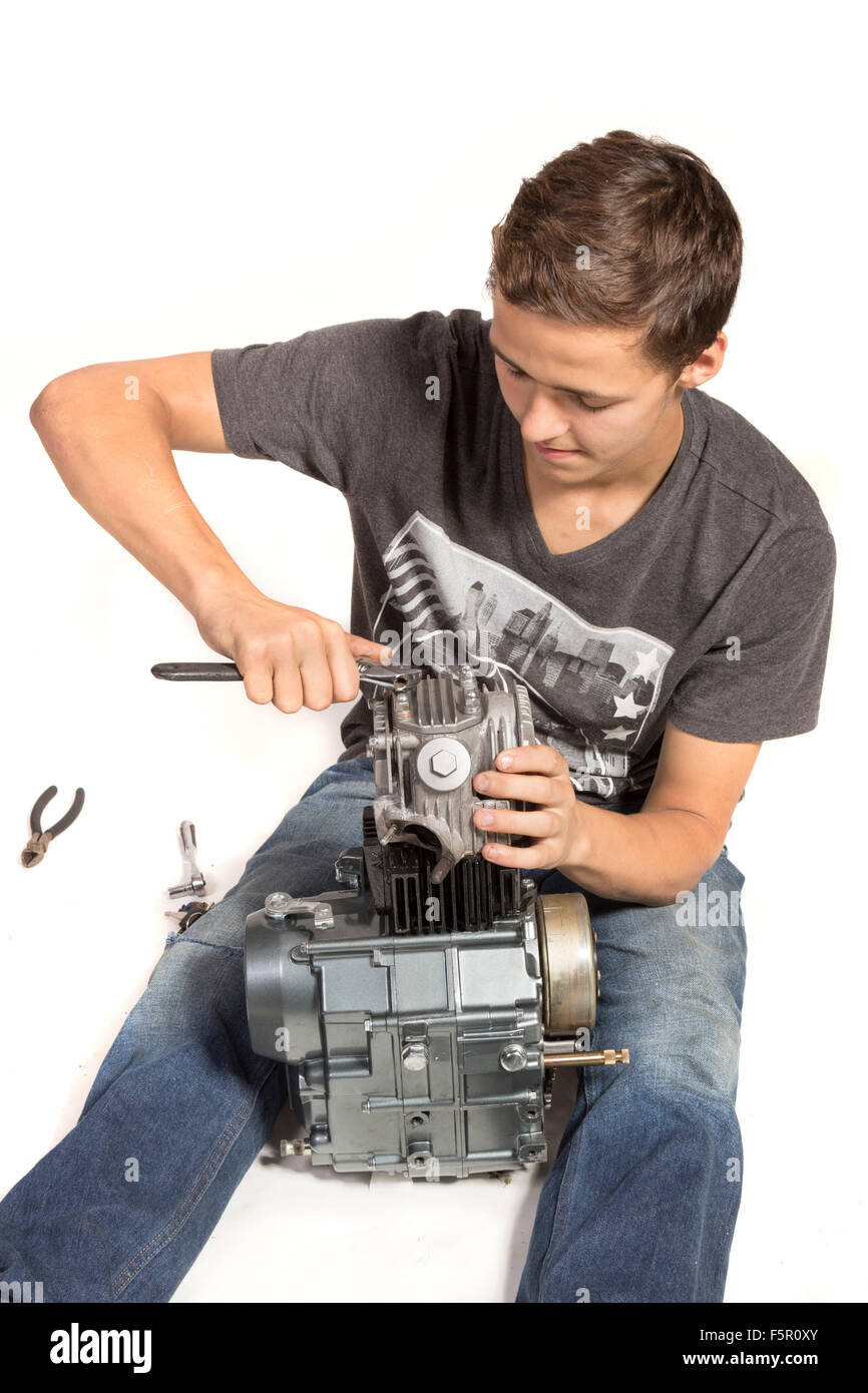 Teenage Boy Fixing an Engine Stock Photo - Alamy