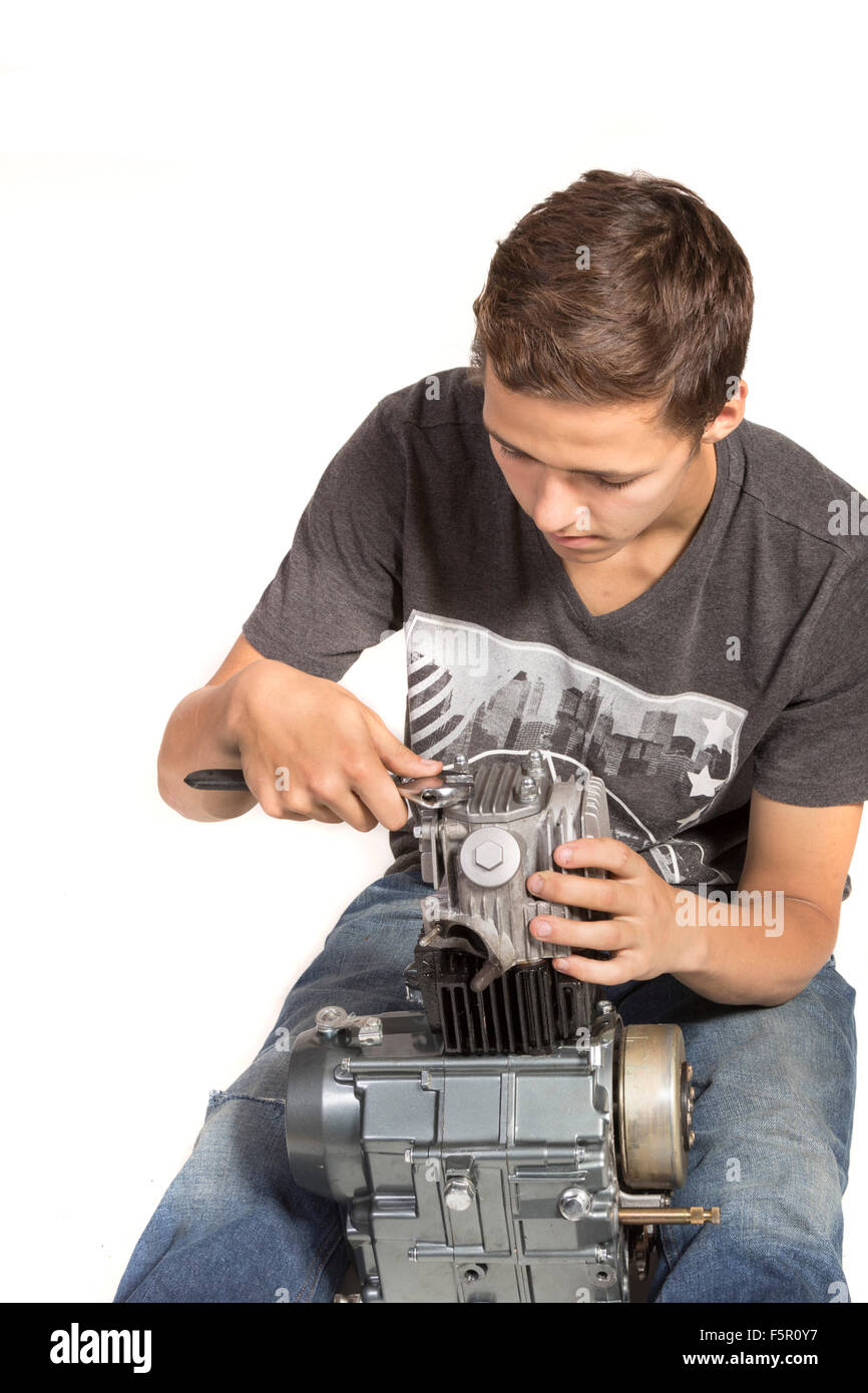 Teenage Boy Fixing an Engine Stock Photo - Alamy