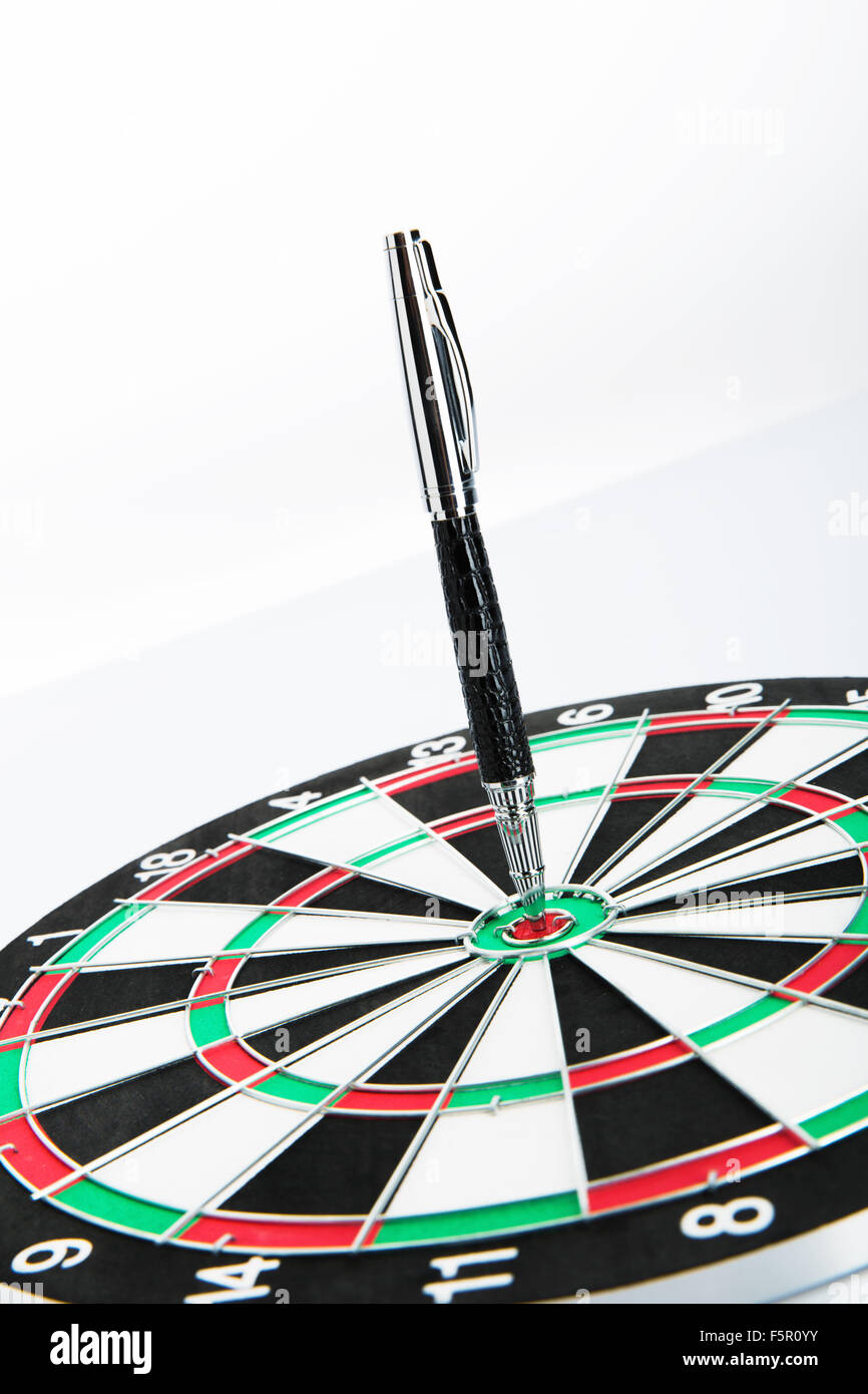 dart board with pen isolated on white background Stock Photo - Alamy