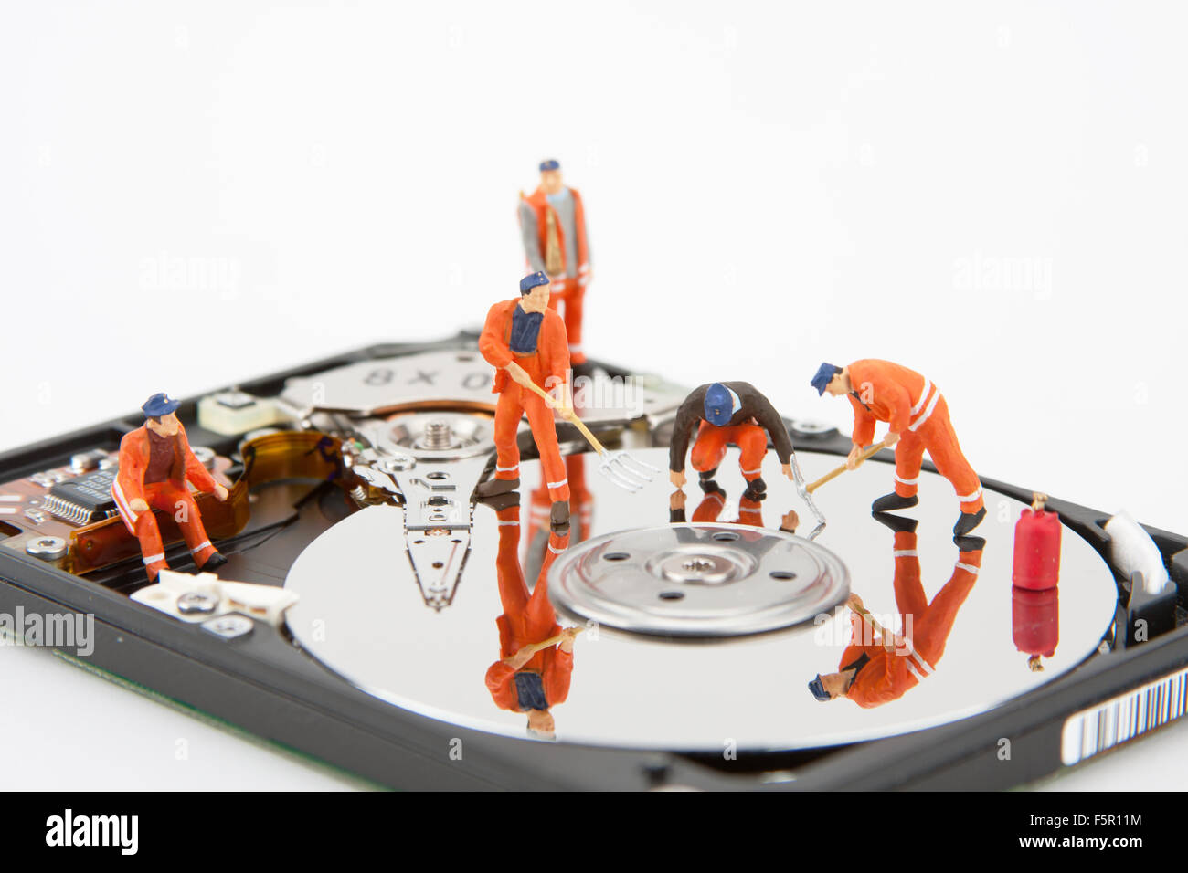IT support. Workers repairing hard disk drive Stock Photo - Alamy