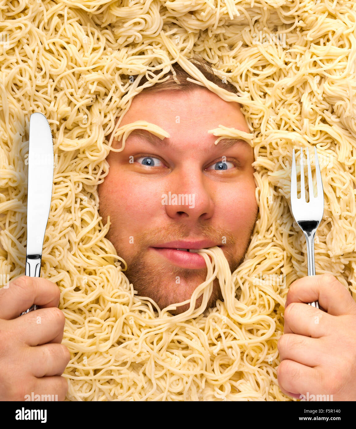 Man's face in pasta, dinner time Stock Photo - Alamy