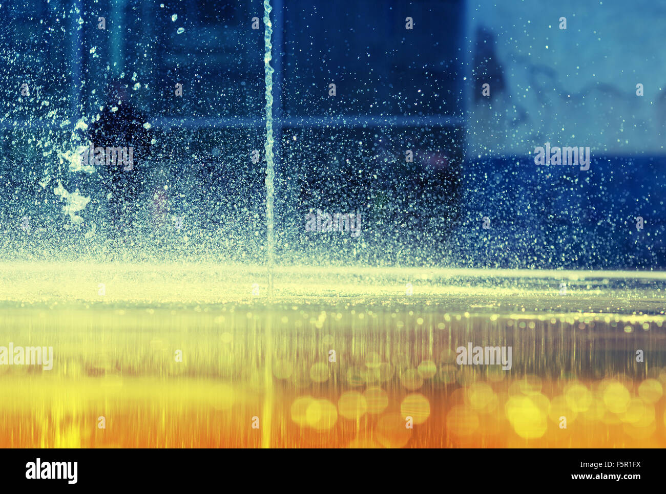 Water stream splashing on ground Stock Photo - Alamy