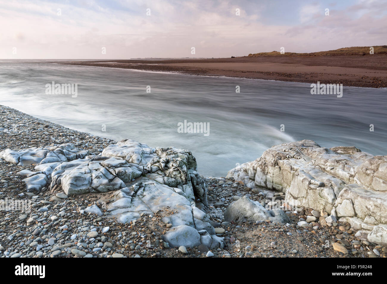 The river Ogmore running in to sea at Ogmore by Sea, Vale of Glamorgan ...