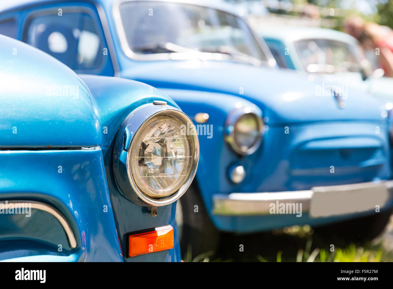 Line of blue retro cars close up Stock Photo - Alamy