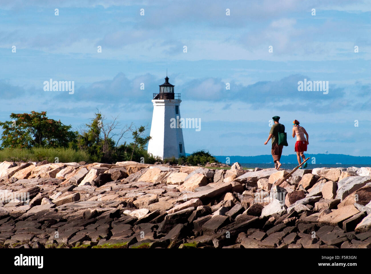Hiking to Black Rock Harbor light along the mile-long jetty, in ...