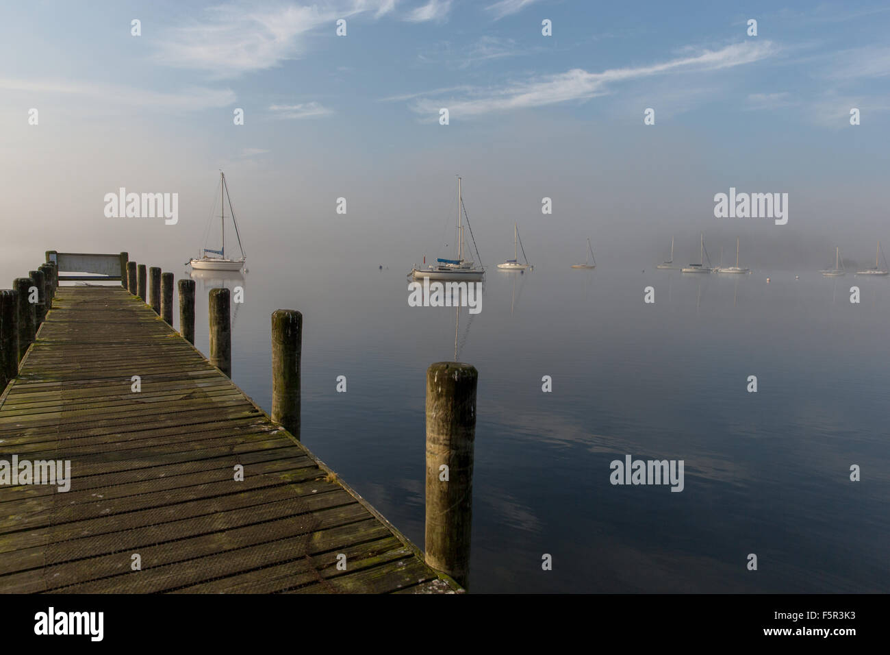 A wooden jetty on Lake Windermere close to a yacht mooring Stock Photo ...