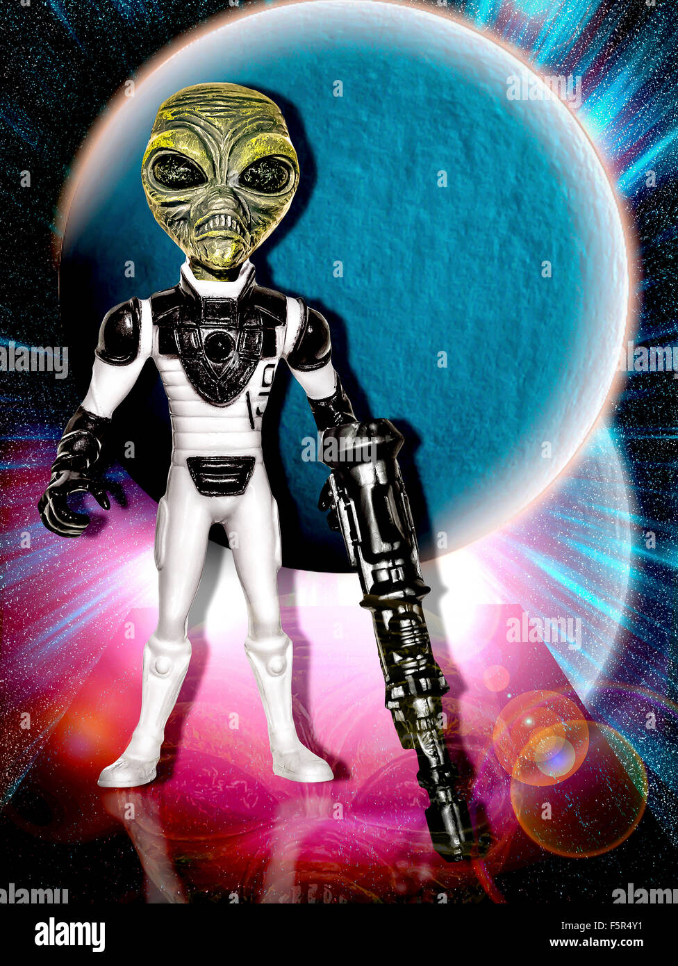 Plastic Toy Alien on Space scene background Stock Photo - Alamy