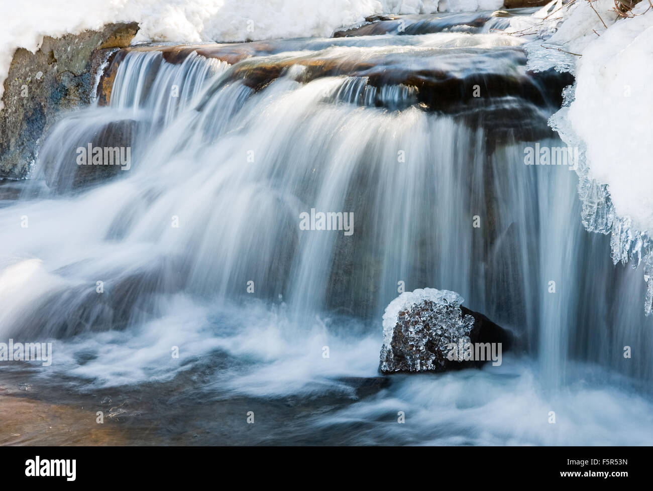 Waterfall movement on the rocks Stock Photo - Alamy