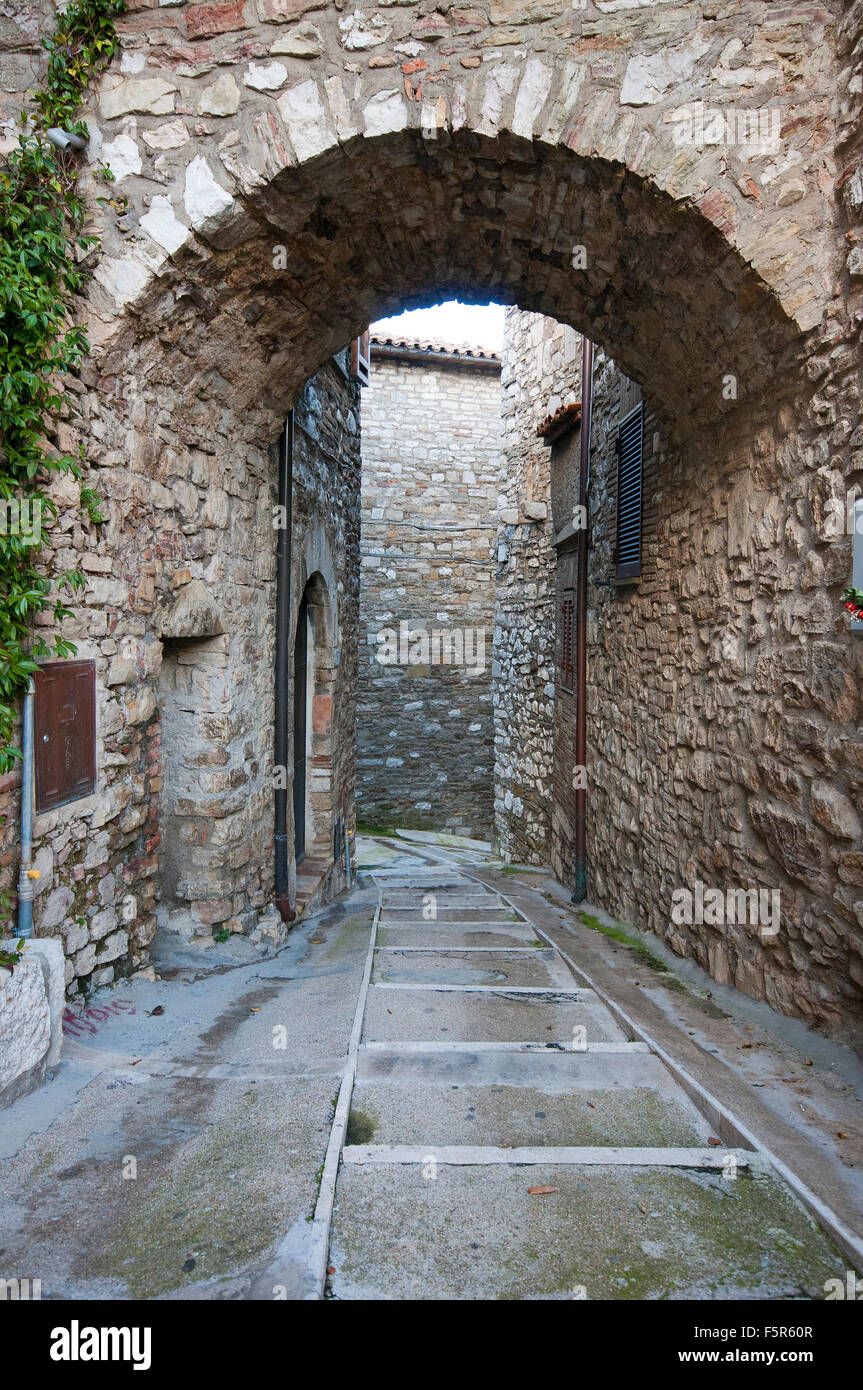 An alley and an ancient arch in Melezzole, small village near ...