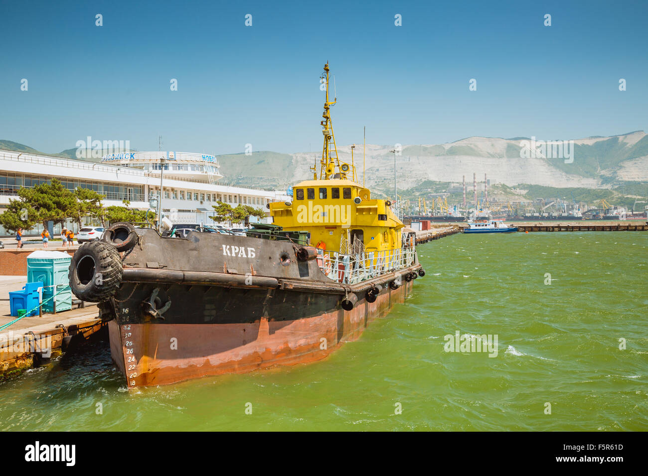 Large tugboat berth in the port of Novorossiysk Stock Photo - Alamy