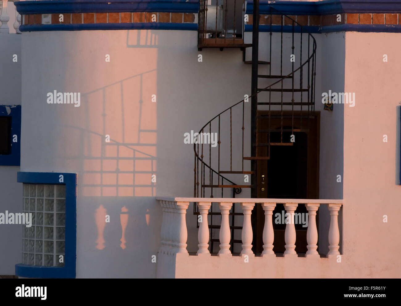 Beach house at sunset with nice shadows from staircase Stock Photo - Alamy