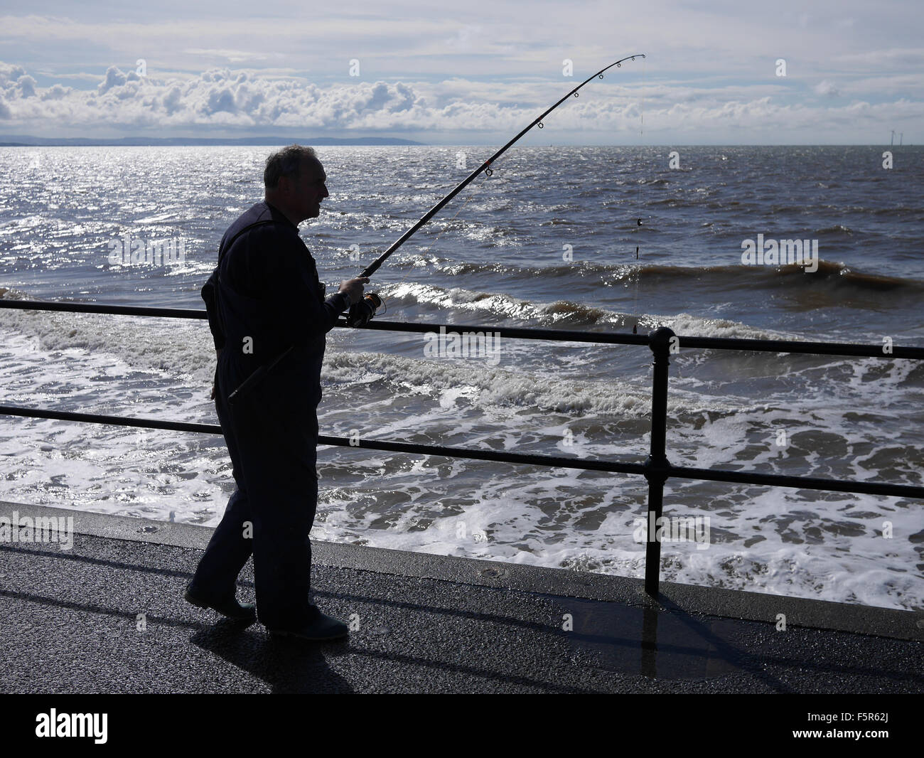 Sea fishing in Crosby Merseyside during high tide Stock Photo - Alamy