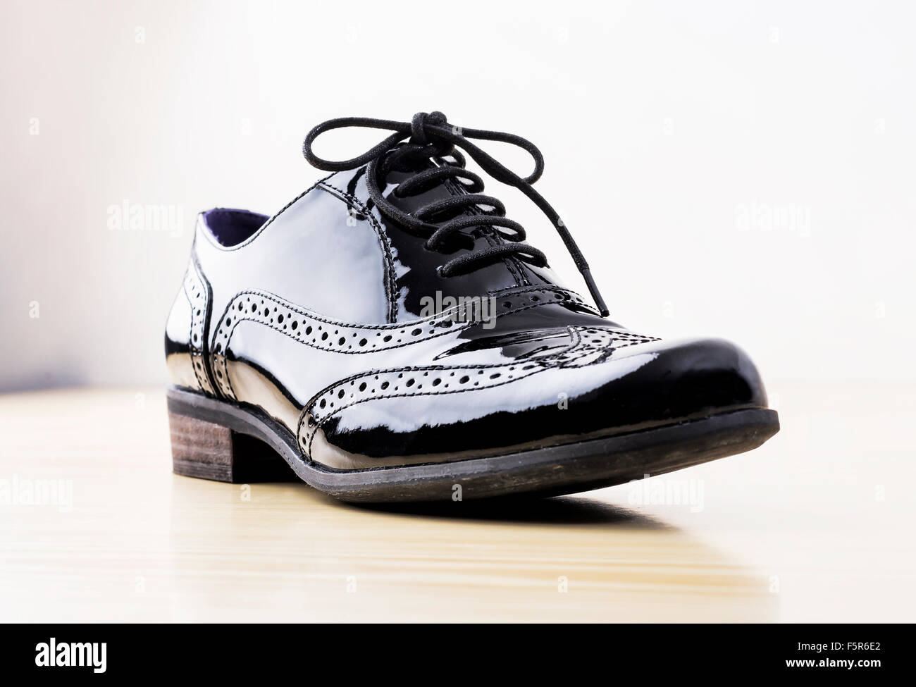 Footwear Concept. Horizontal Image. Black female classic leather shoes ...