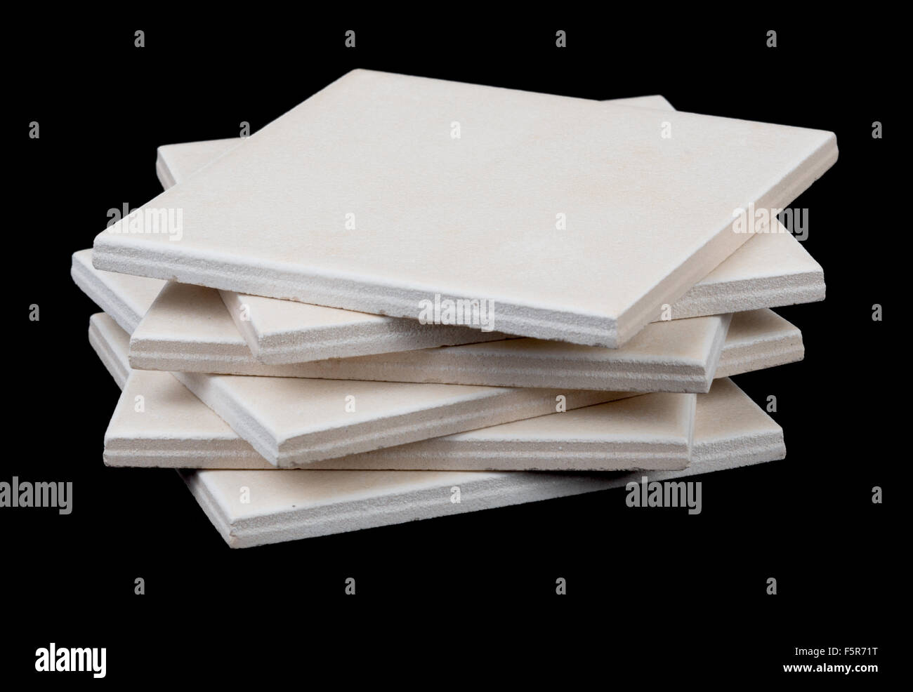 Stack of tiles on black Stock Photo - Alamy
