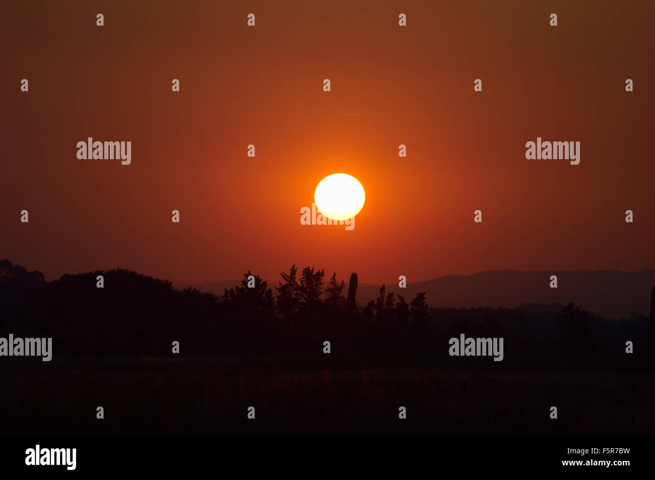 the sun like a ball at sunset Stock Photo - Alamy