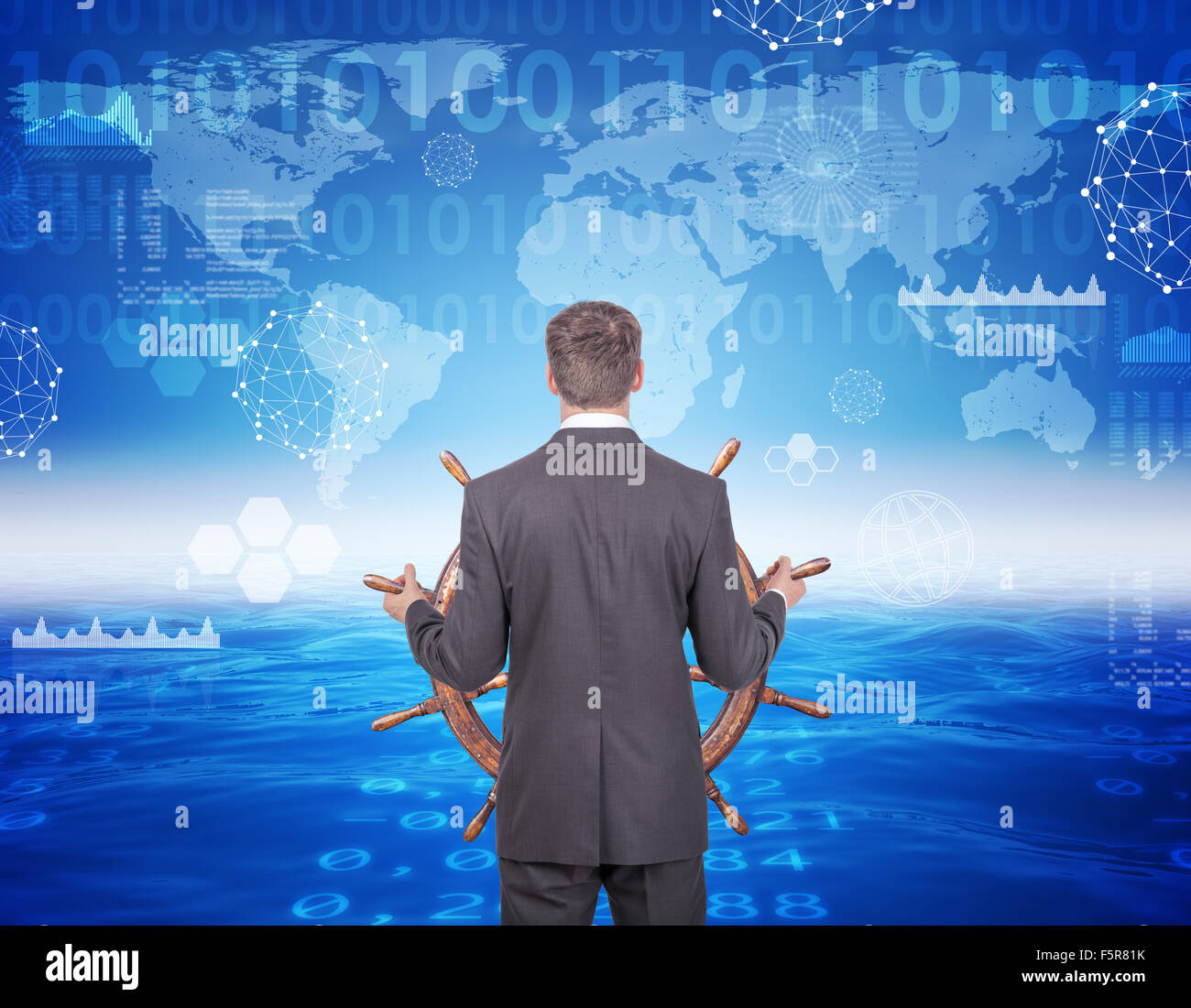 Man with steering wheel and world map Stock Photo - Alamy