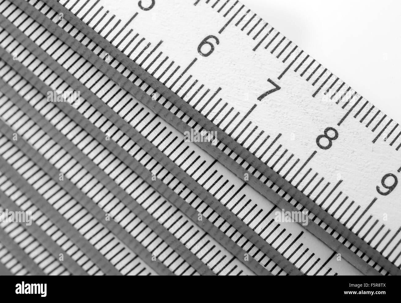 Closeup of white wooden rulers Stock Photo - Alamy