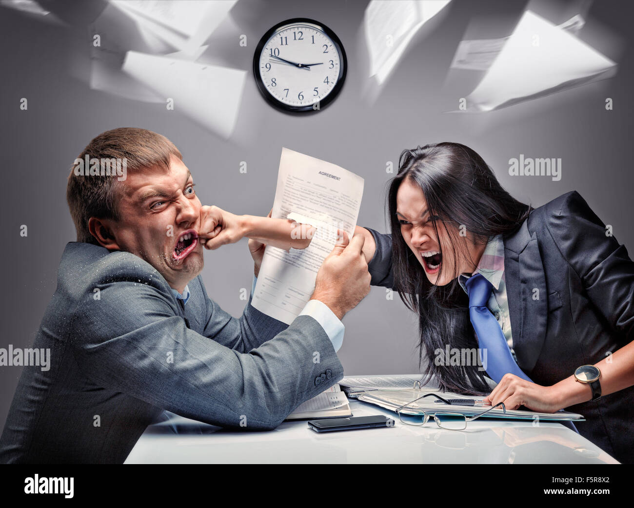 Two office workers starting to fight Stock Photo - Alamy
