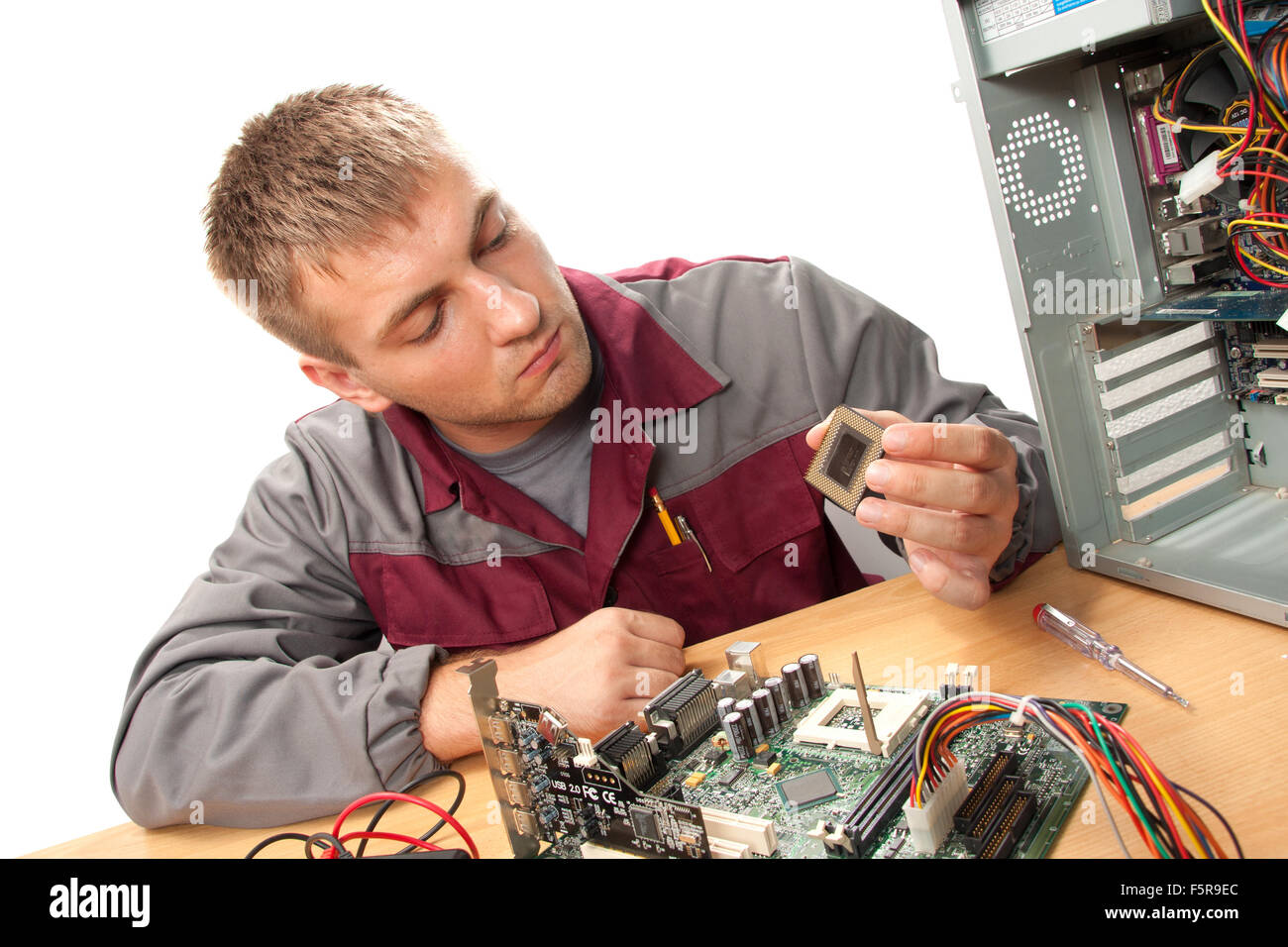 Computer support engineer installing processor Stock Photo - Alamy