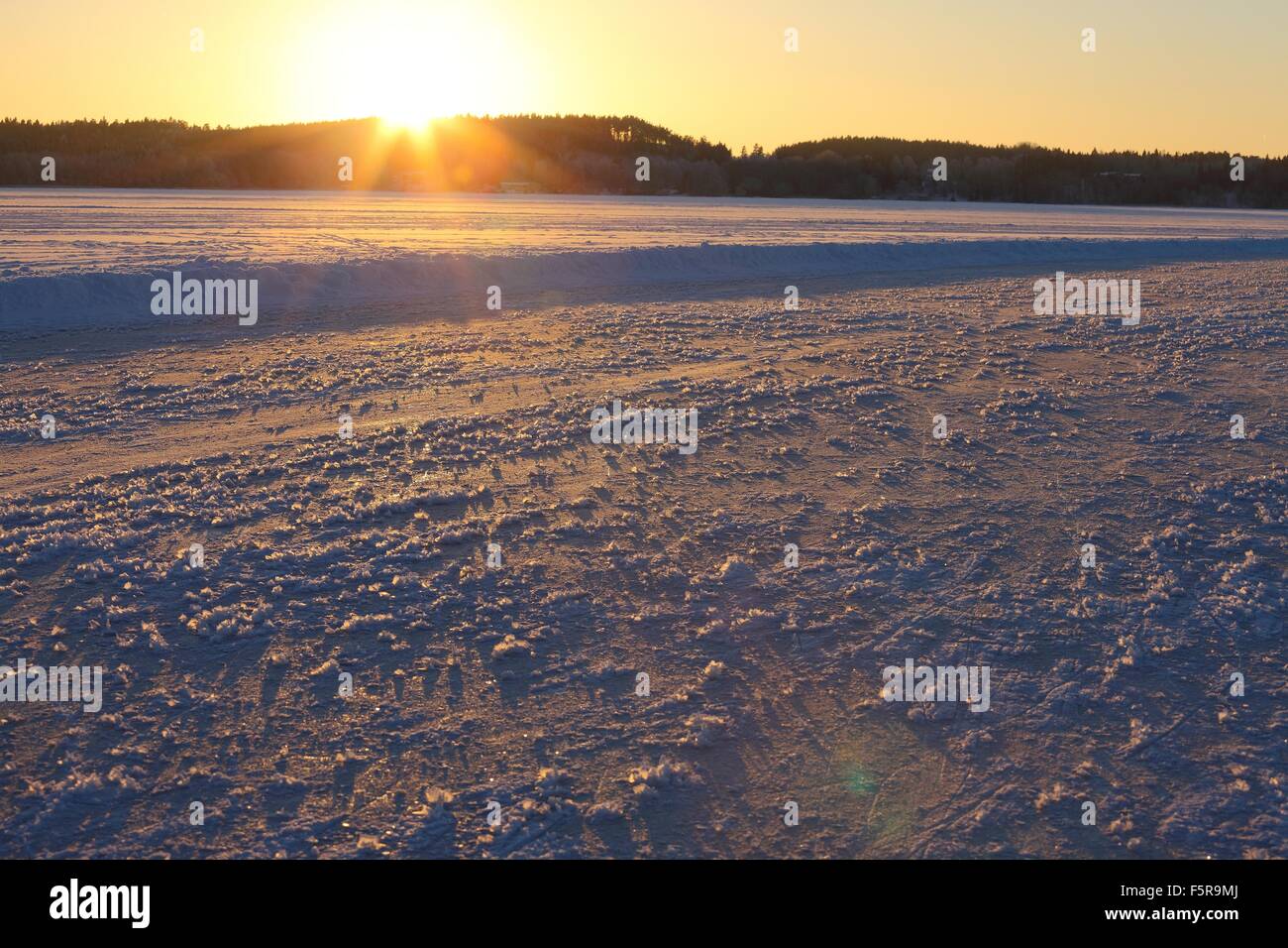 Frozen lake sunset Stock Photo - Alamy