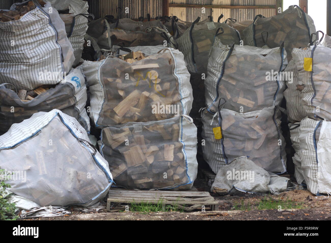 Bagged chopped firewood stock Stock Photo - Alamy