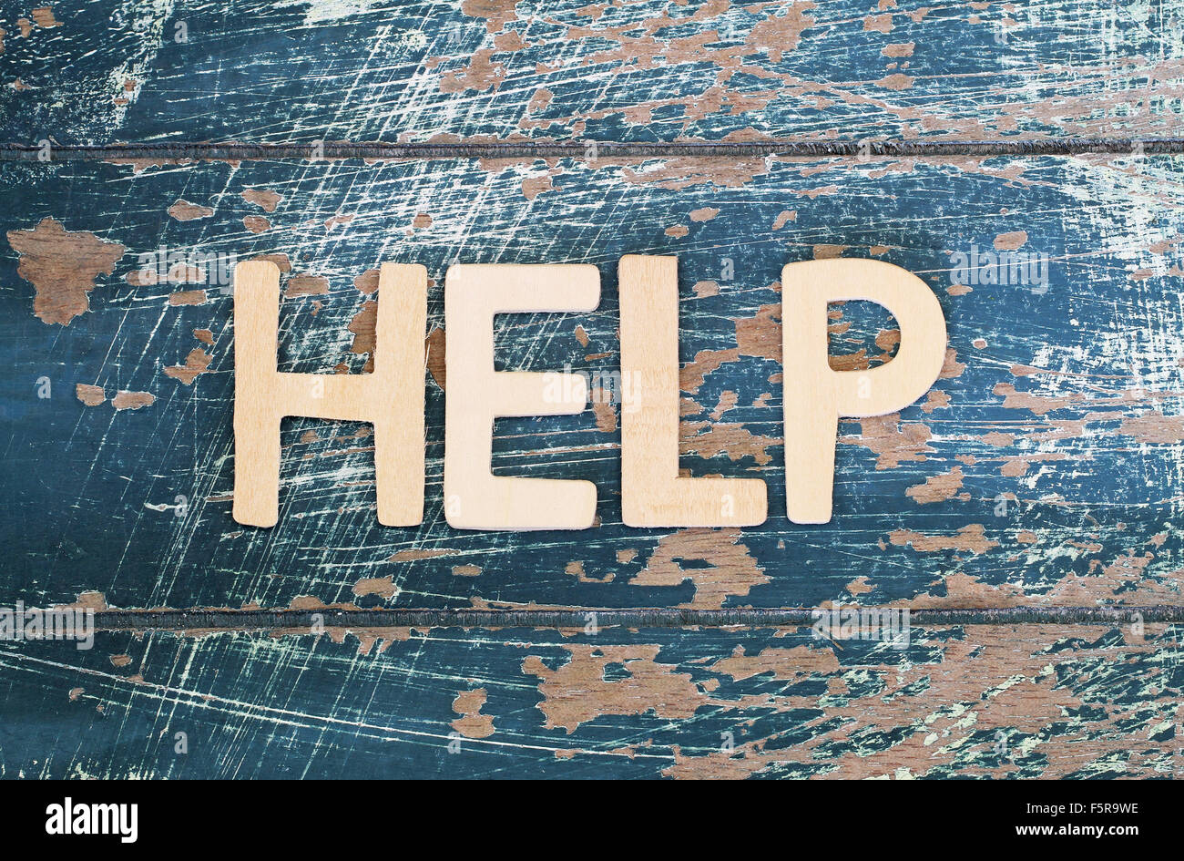 Word help written on rustic wooden surface Stock Photo - Alamy