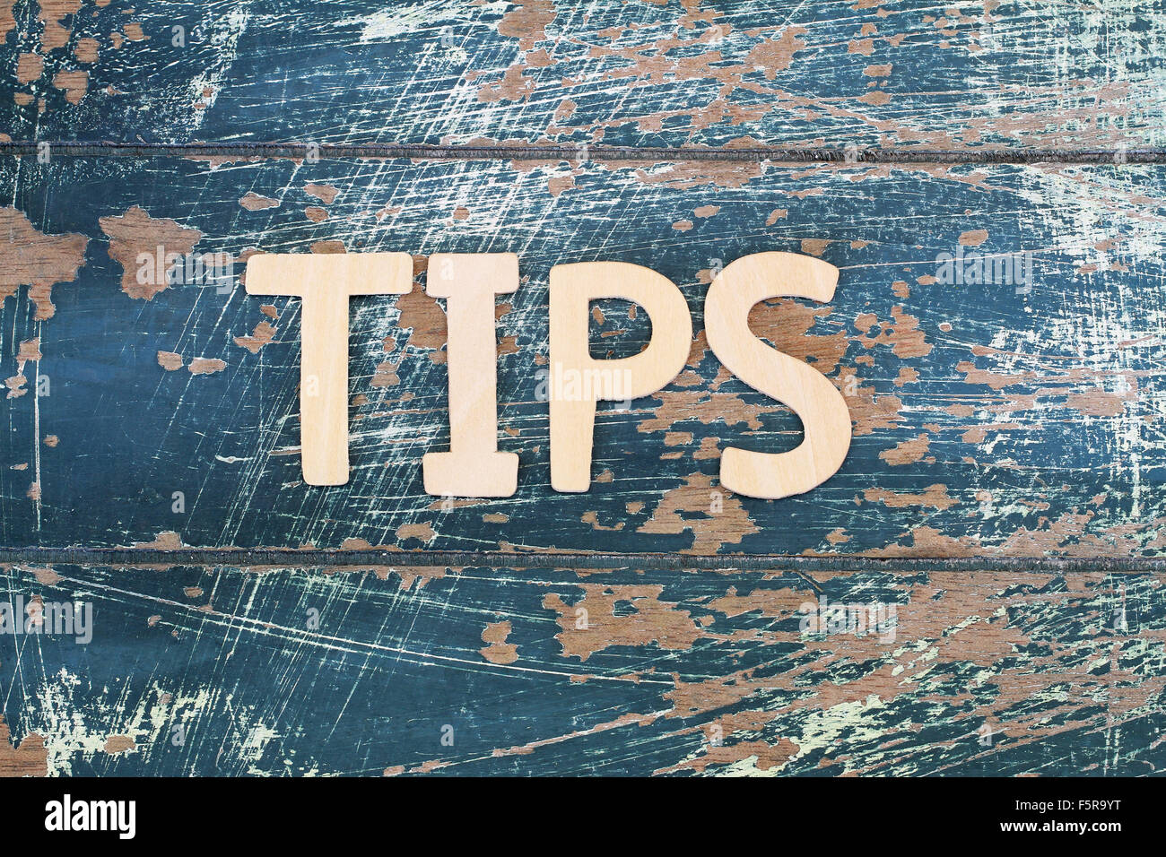 Word tips written on rustic wooden surface Stock Photo - Alamy
