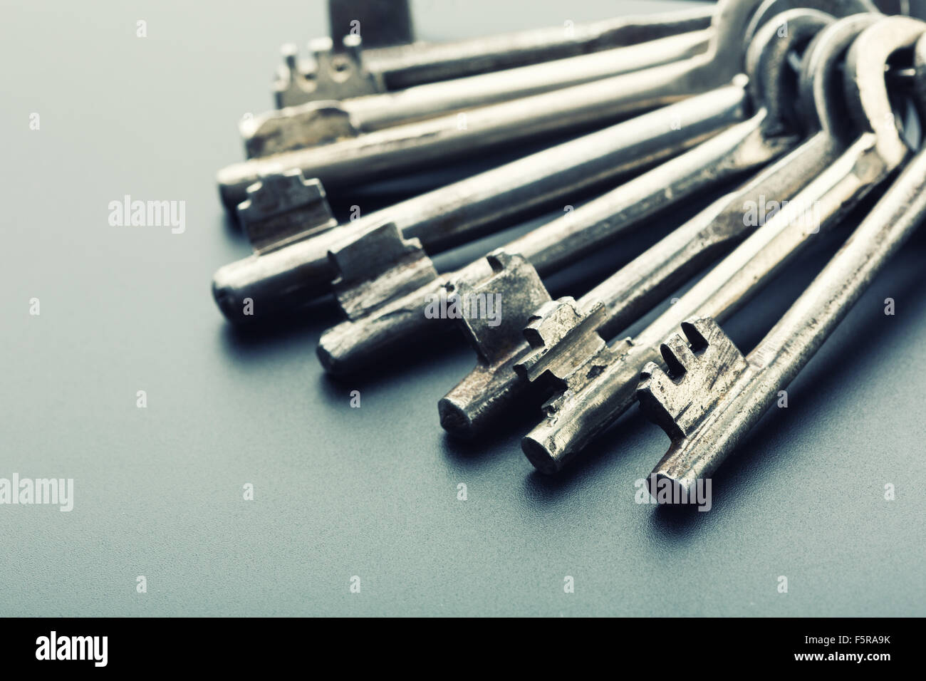 Bunch of old keys on grey background. Closeup view Stock Photo - Alamy