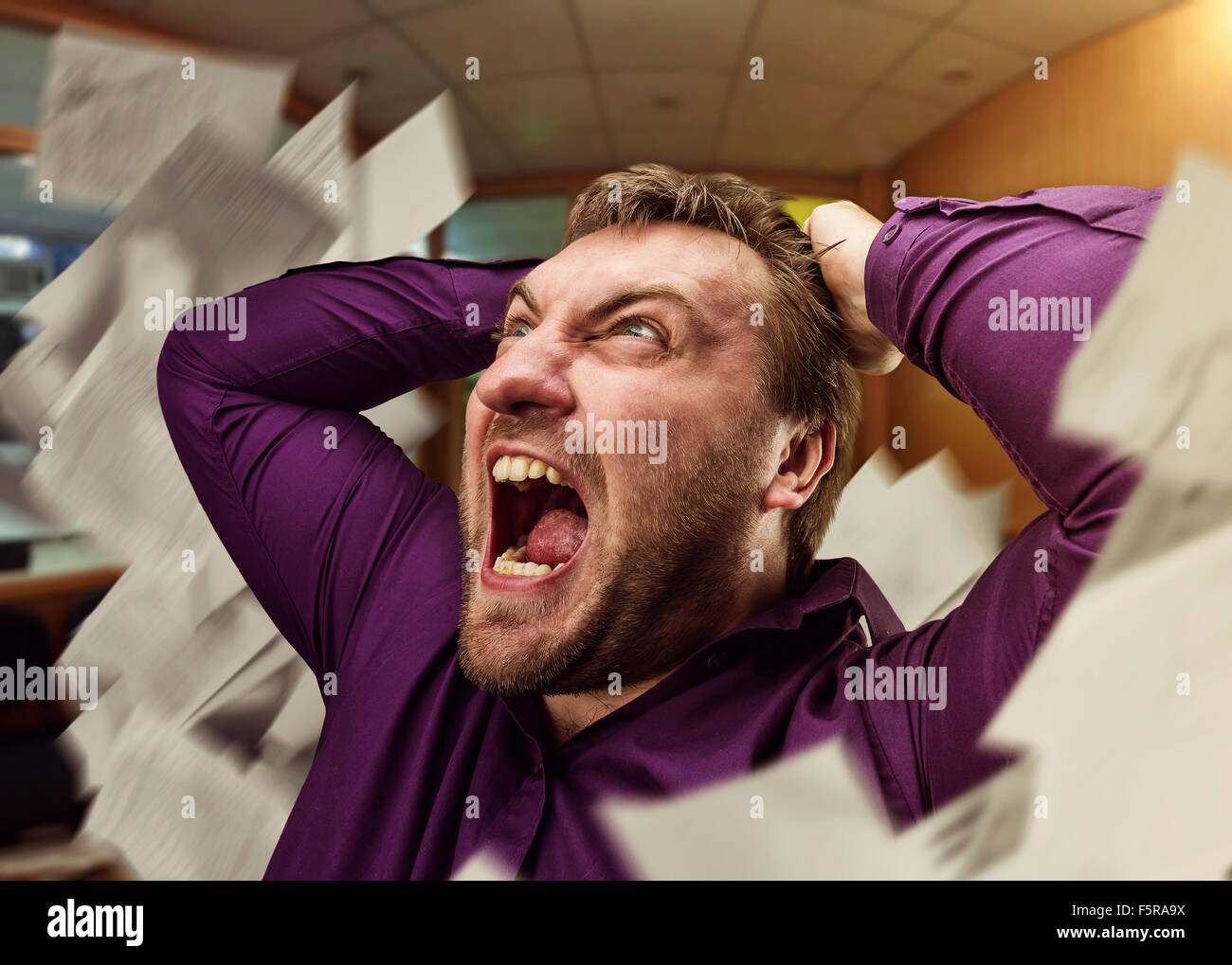 Mad businessman screaming in the office Stock Photo - Alamy