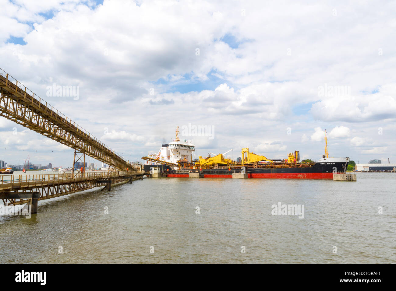 The cargo ship Sand Fulmer offloading its cargo of aggregate while ...