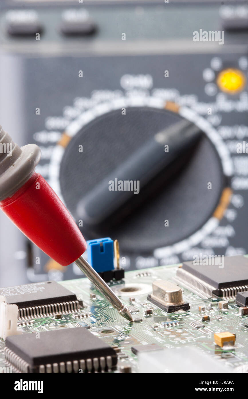 Probe of digital multimeter analyzing electronics circuit Stock Photo ...