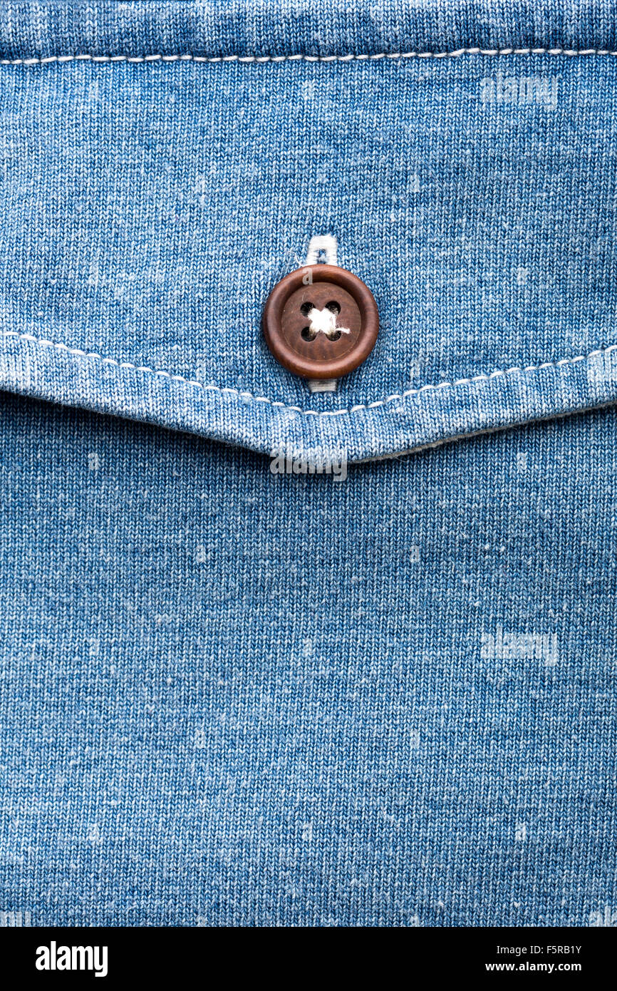 A closeup of jeans pocket with plastic button Stock Photo - Alamy