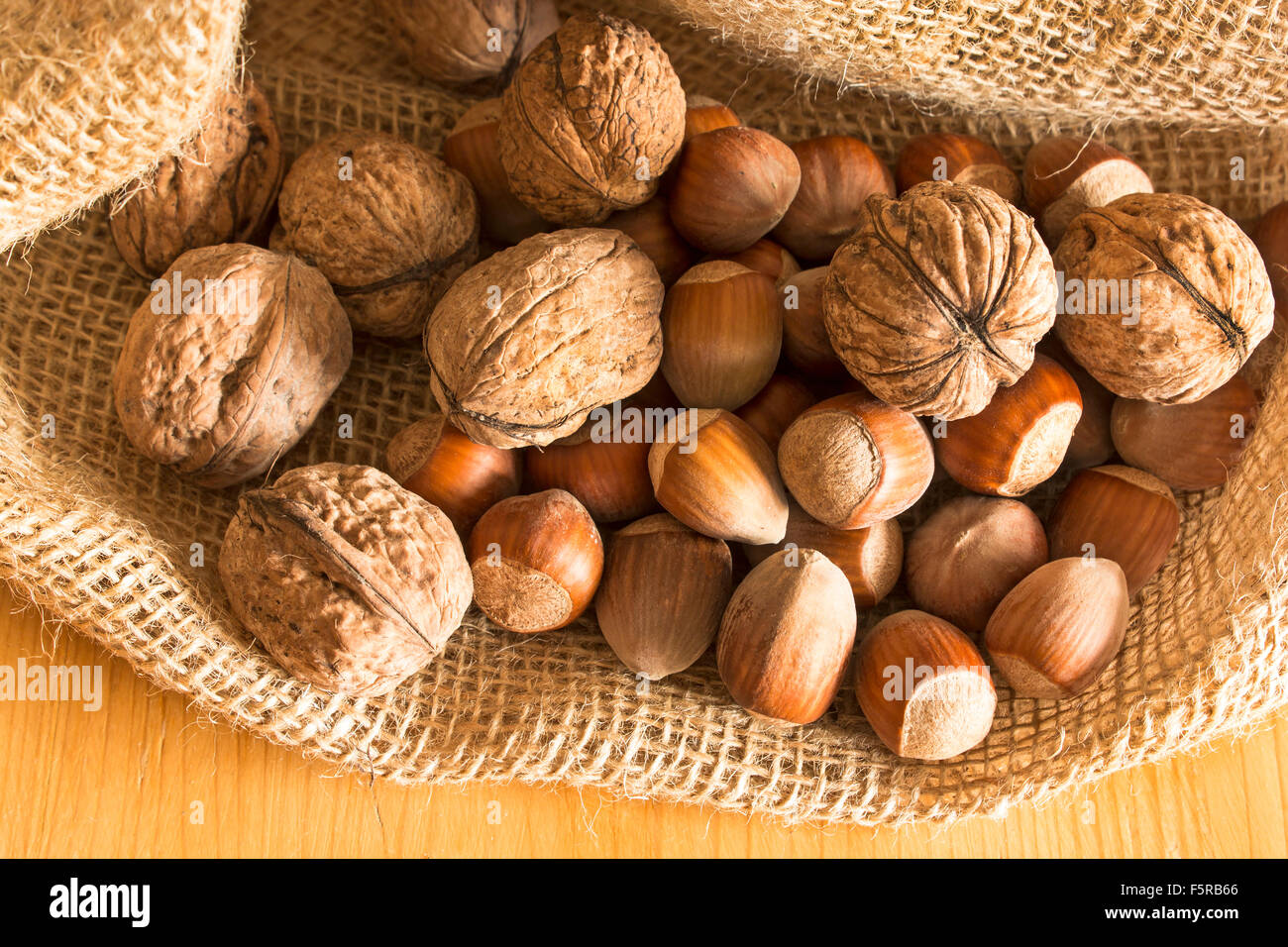 Ripe walnuts in husks hi-res stock photography and images - Alamy